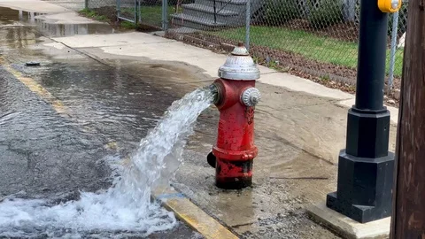 Water flowing from open fire hydrant | Stock Video | Pond5
