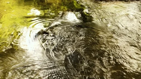 Water flowing in river. Water closeup in... | Stock Video | Pond5