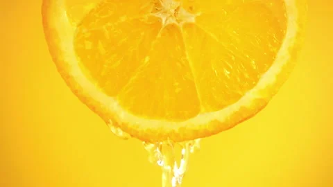 Water flows down from a slice of lemon o... | Stock Video | Pond5