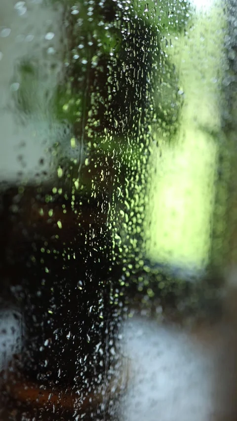 water flows on the glass in the house. r... | Stock Video | Pond5