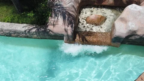 water flows pouring into the swimming po... | Stock Video | Pond5