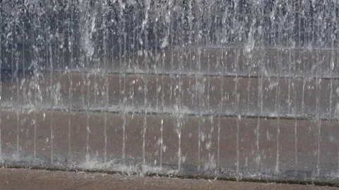 Water jet splashing on water surface. | Stock Video | Pond5