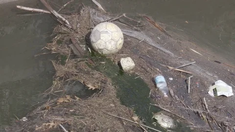 Water Pollution - Garbage with Soccer Ba... | Stock Video | Pond5