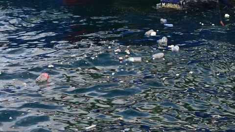 water pollution with garbage on water | Stock Video | Pond5