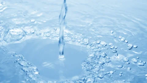Water is pouring creating ripples and bu... | Stock Video | Pond5