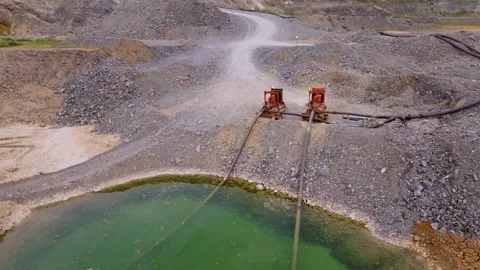 Water pumps at large open-pit mine keepi... | Stock Video | Pond5