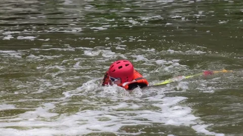 water rescue man swimming towards camera... | Stock Video | Pond5
