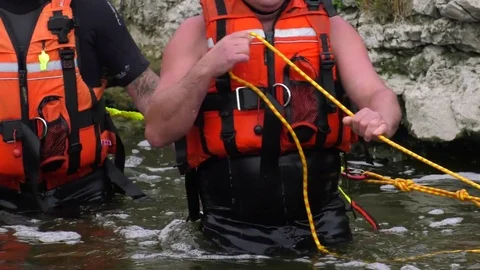 water rescue men in wetsuits 4k | Stock Video | Pond5