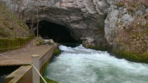 Water rushing out of Planina cave in Slo... | Stock Video | Pond5