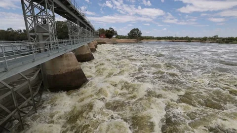 Water rushing threw the main weir at the... | Stock Video | Pond5