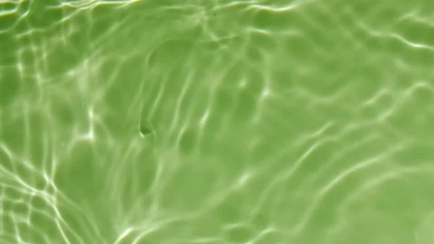 Water splash green colored. Drop falls i... | Stock Video | Pond5