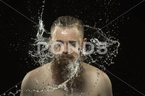 Water splashing on shirtless man's face against black background ~ Hi ...