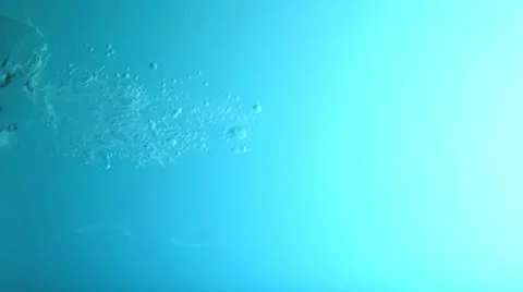 Water spreading on blue background | Stock Video | Pond5