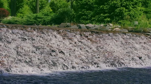 Water stream falling down over stone cas... | Stock Video | Pond5