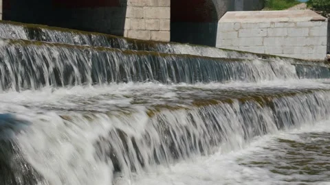 Water stream flowing down steps on small... | Stock Video | Pond5