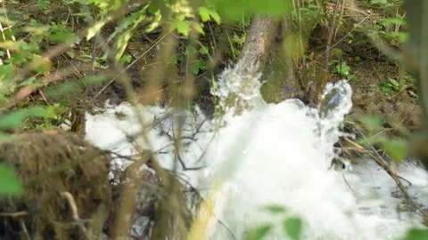 Water striking from the ground in the fo... | Stock Video | Pond5