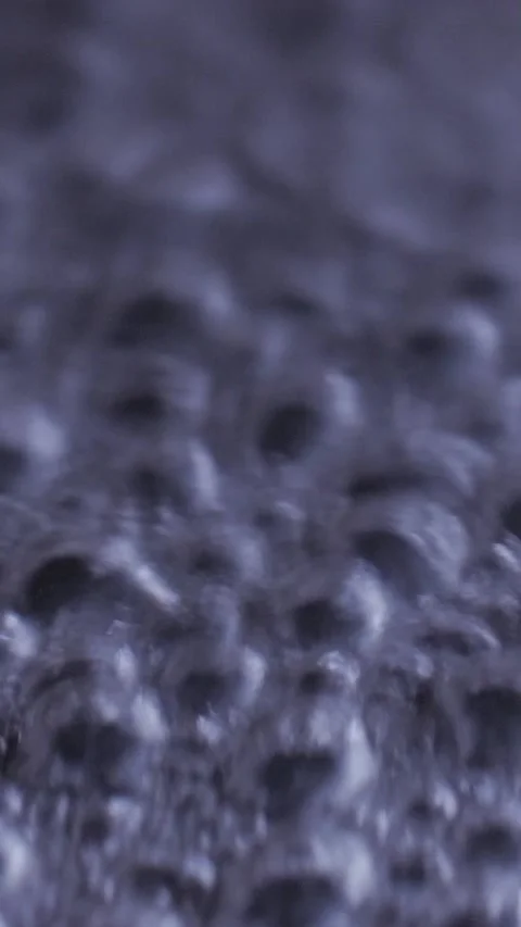 Water surface tension breaking. Vertical... | Stock Video | Pond5