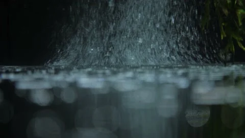 Water Surface with Water Falling in Back... | Stock Video | Pond5