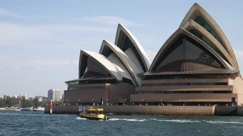 Water taxi passes Sydney Opera House 4K | Stock Video | Pond5