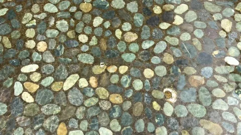 Water texture in pool with pebble rocks | Stock Video | Pond5