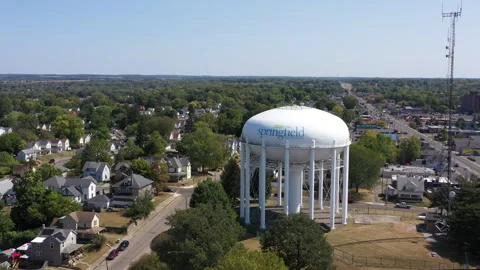 Water tower with neighborhood in backgro... | Stock Video | Pond5