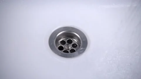 The water is washed into the water drain... | Stock Video | Pond5
