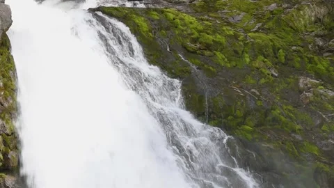 water from a waterfall in the Dolomites | Stock Video | Pond5