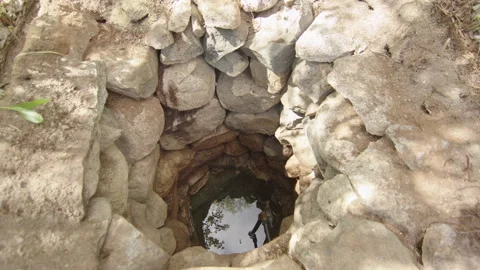 Water well lined with rocks with undergr... | Stock Video | Pond5