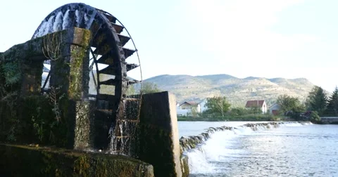 a water wheel to lift water for irrigati... | Stock Video | Pond5