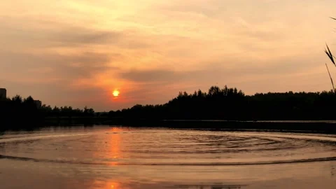 Waterdrop falling on lake water surface ... | Stock Video | Pond5