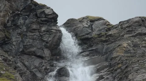 waterfall and pan down in High Tauern na... | Stock Video | Pond5