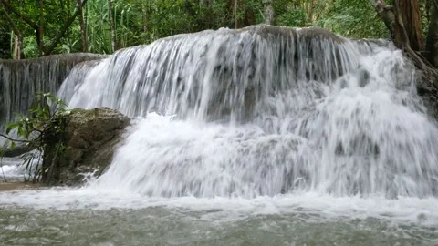 Waterfall flowing rapids in tropical rai... | Stock Video | Pond5