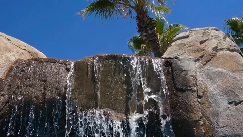 Waterfall flows from a cliff in slow mot... | Stock Video | Pond5