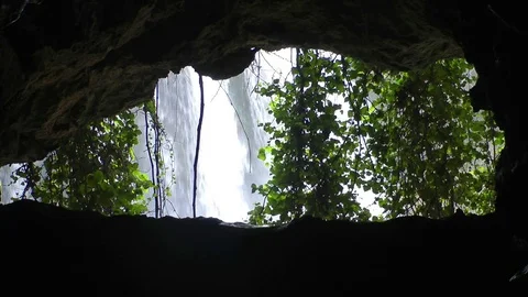 Waterfall inside the Dark Cave | Stock Video | Pond5