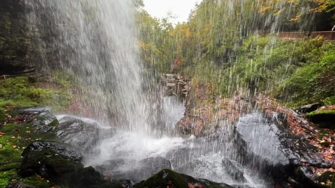 Waterfall looking out from inside a cave... | Stock Video | Pond5