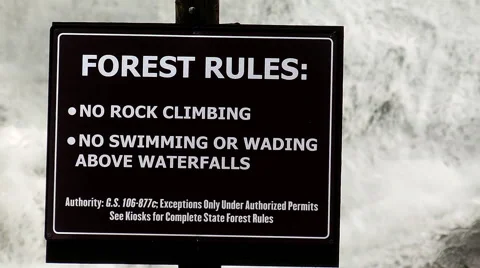 waterfall safety sign with water fall ba... | Stock Video | Pond5