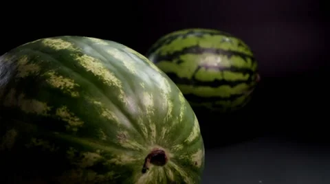 Watermelon slice rotation on a black bac... | Stock Video | Pond5