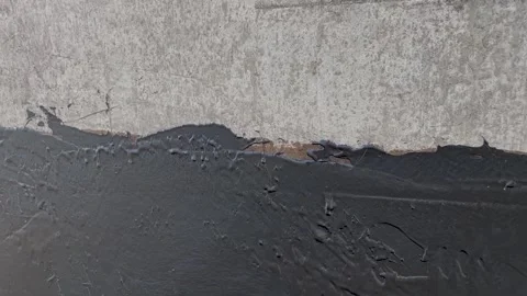 Waterproofing a concrete wall with liqui... | Stock Video | Pond5