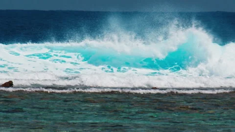 Wave breaks on the shallow coral reef in... | Stock Video | Pond5