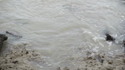 Waves of sea water lapping against moss-... | Stock Video | Pond5