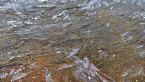 Waves shake melted ice, spring melting t... | Stock Video | Pond5