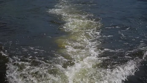 Waves, a trail of water behind the boat.... | Stock Video | Pond5