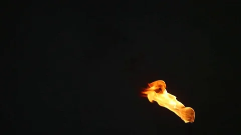 waving fire torch in front of camera, on... | Stock Video | Pond5