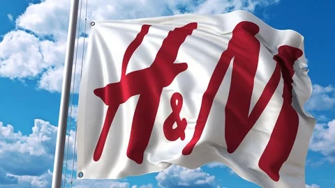 Waving flag with H&M logo against moving... | Stock Video | Pond5