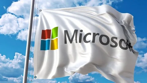 Waving flag with Microsoft logo against ... | Stock Video | Pond5