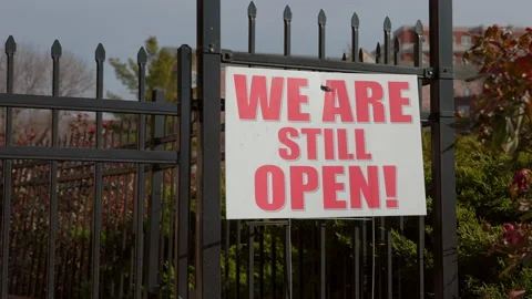 We Are Open Still sign on business durin... | Stock Video | Pond5