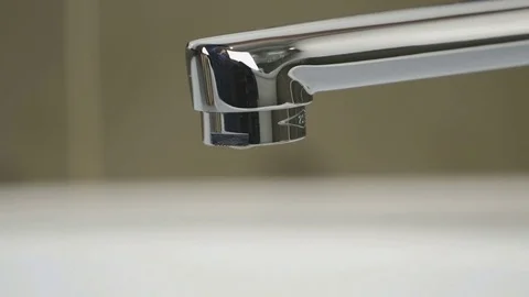 Weak flow of water pouring from chrome t... | Stock Video | Pond5