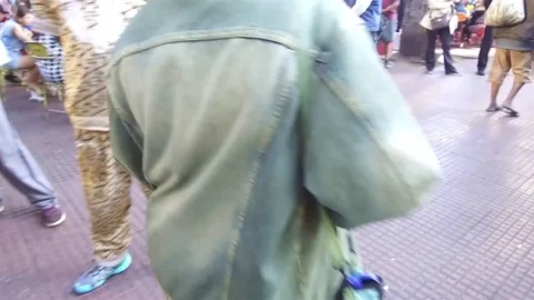 Wearing A Denim Jacket Near Crowd At Foo... | Stock Video | Pond5