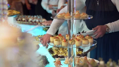 Wedding, buffet, guests take food. | Stock Video | Pond5