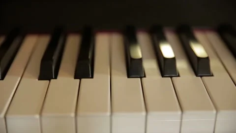 wedding rings on the keys of the old pia... | Stock Video | Pond5